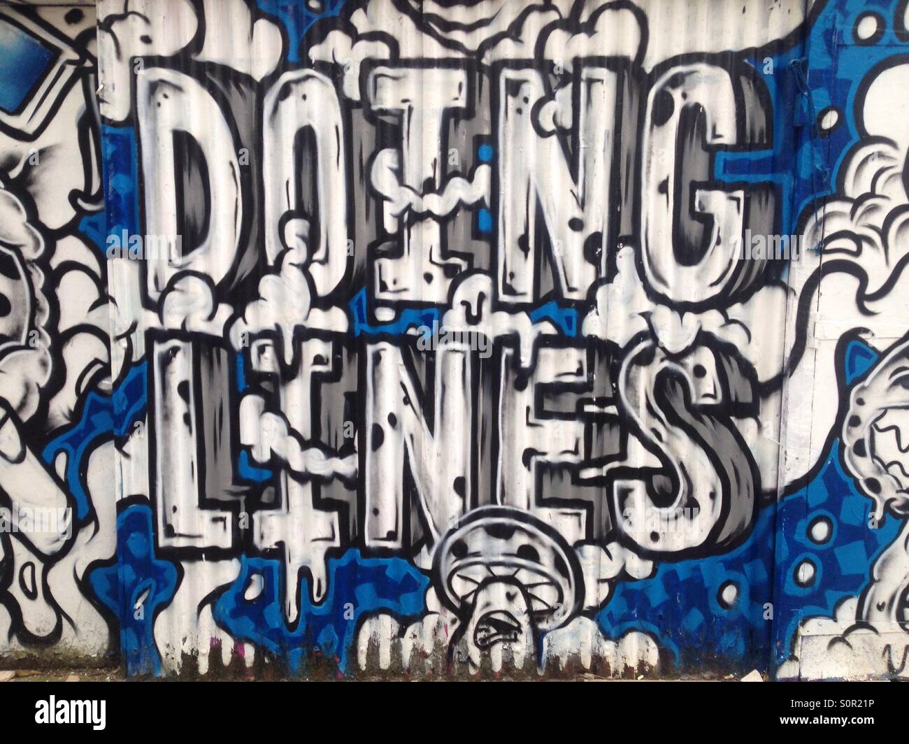 Doing Lines graffiti Stock Photo - Alamy