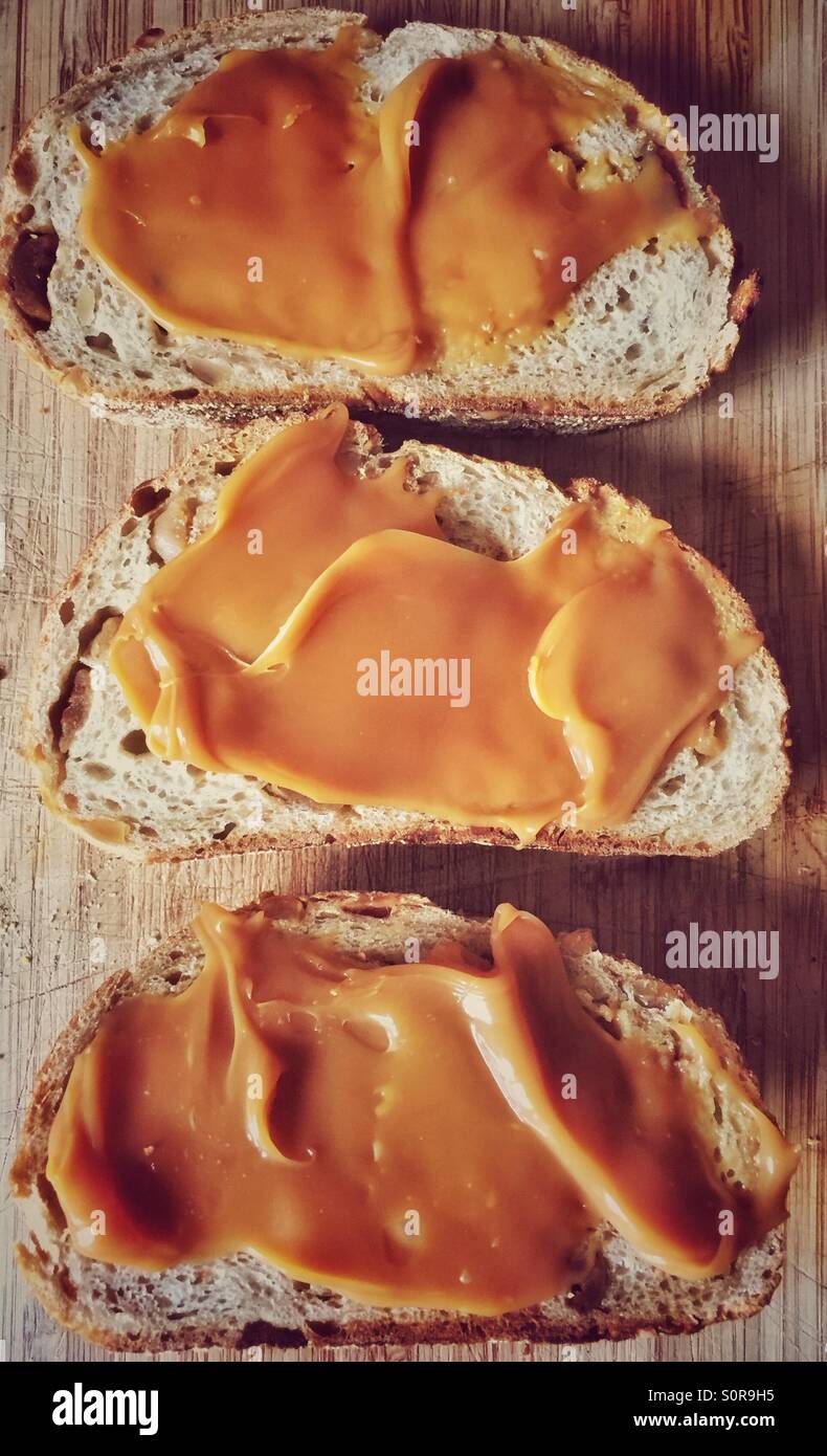 Caramel spread on fresh bread Stock Photo - Alamy
