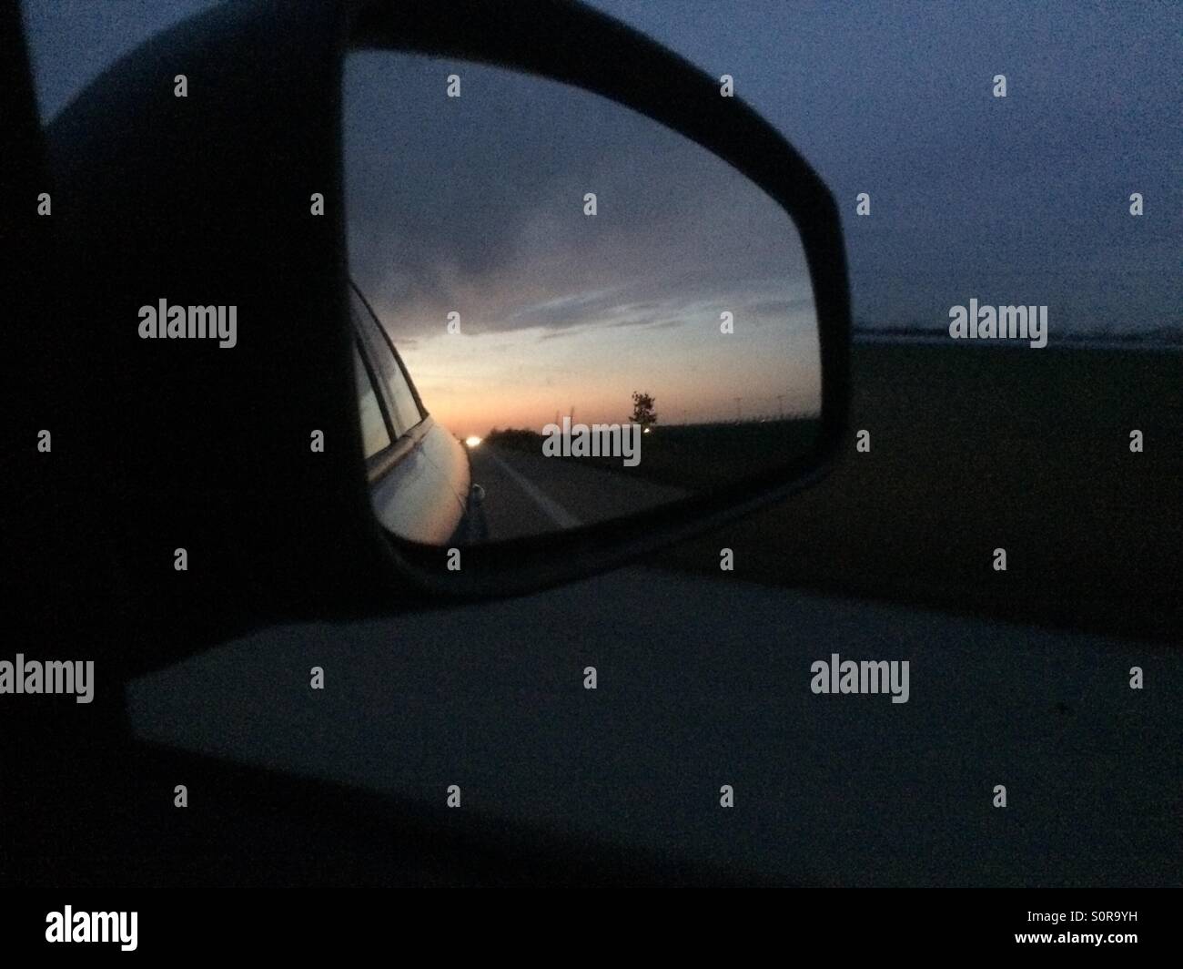 Sunset in the mirror Stock Photo - Alamy