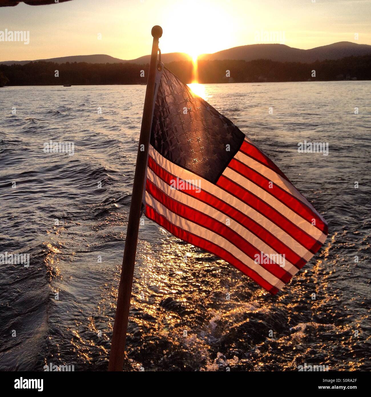 American flag illuminated setting sun hi-res stock photography and ...