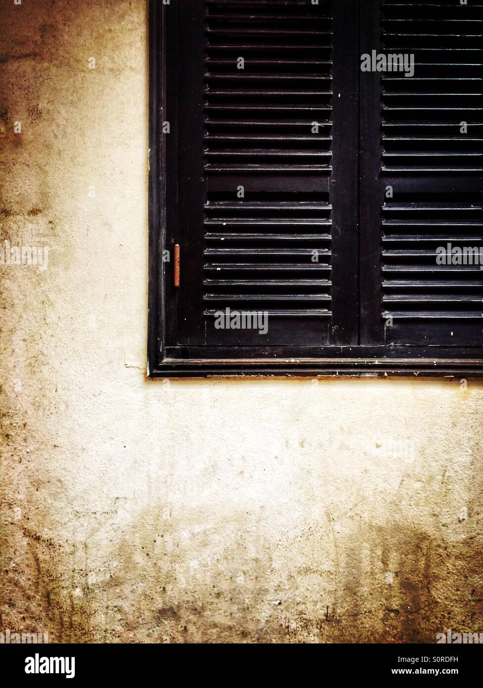 Building wall with wooden window shutters Stock Photo - Alamy