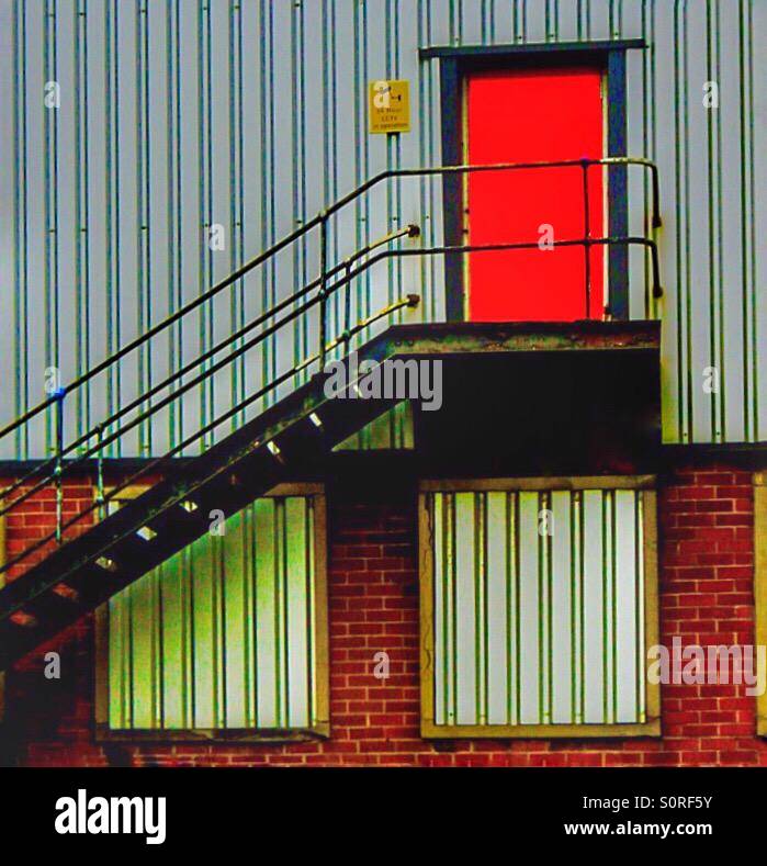 Hi rise door and metal stairway Stock Photo - Alamy