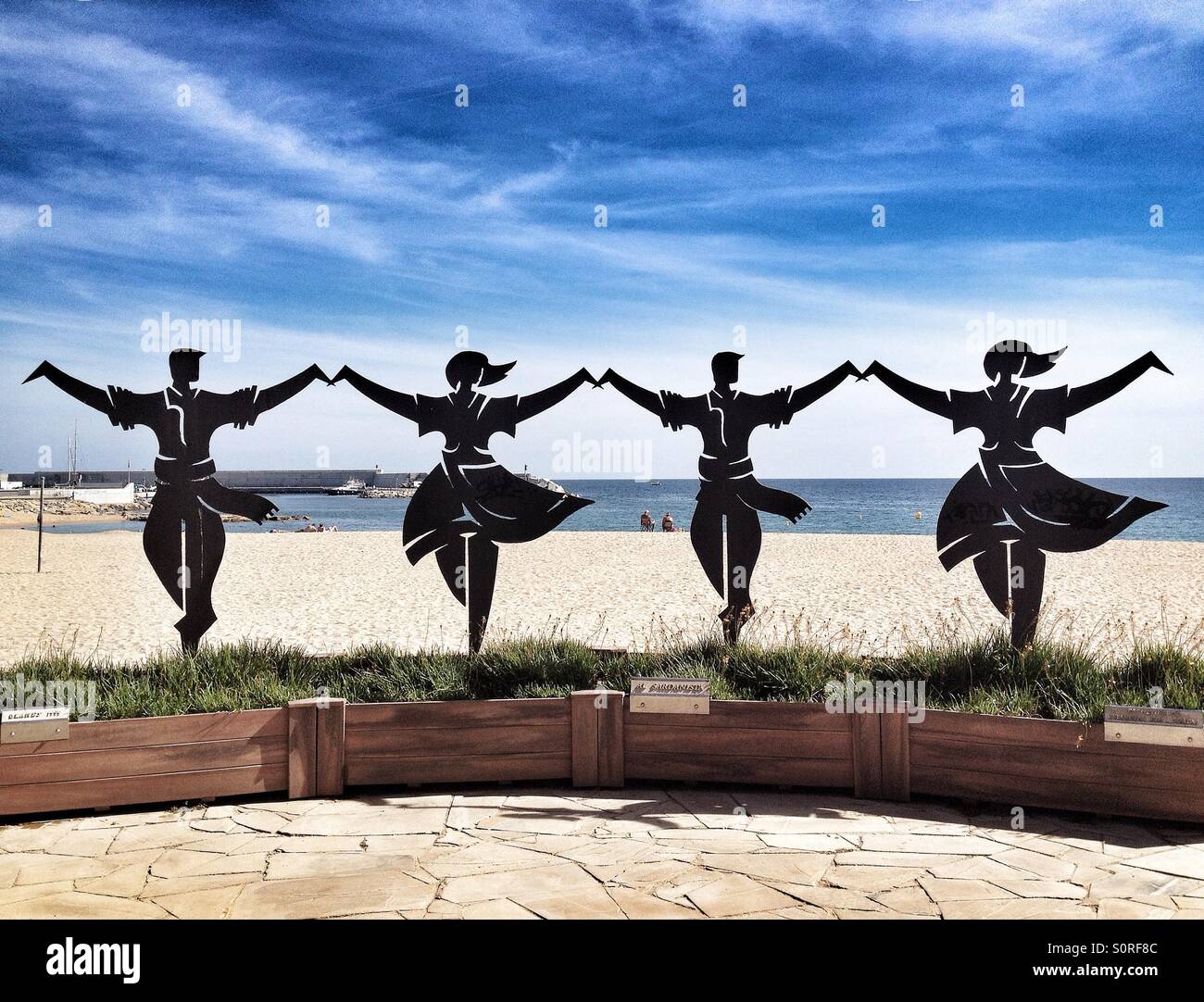 Sculpture showing the Sardana, National dance in Catalonia, in Blanes ...
