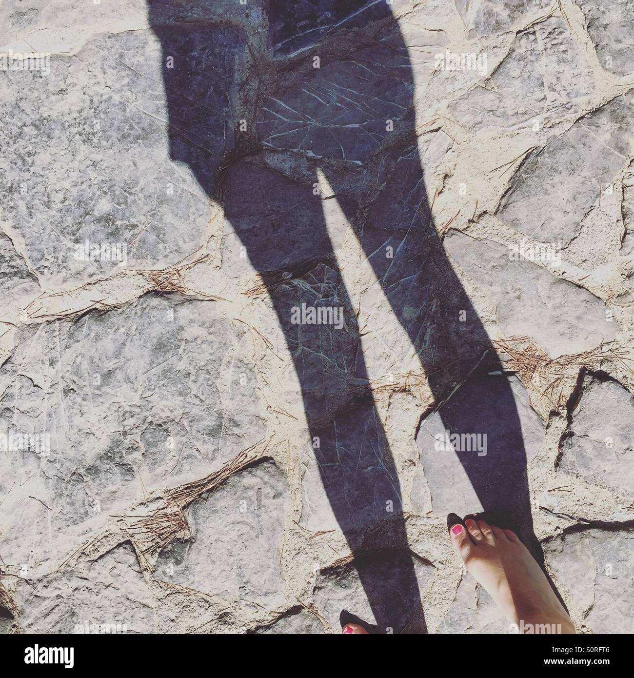 Tall and skinny shadow Stock Photo - Alamy