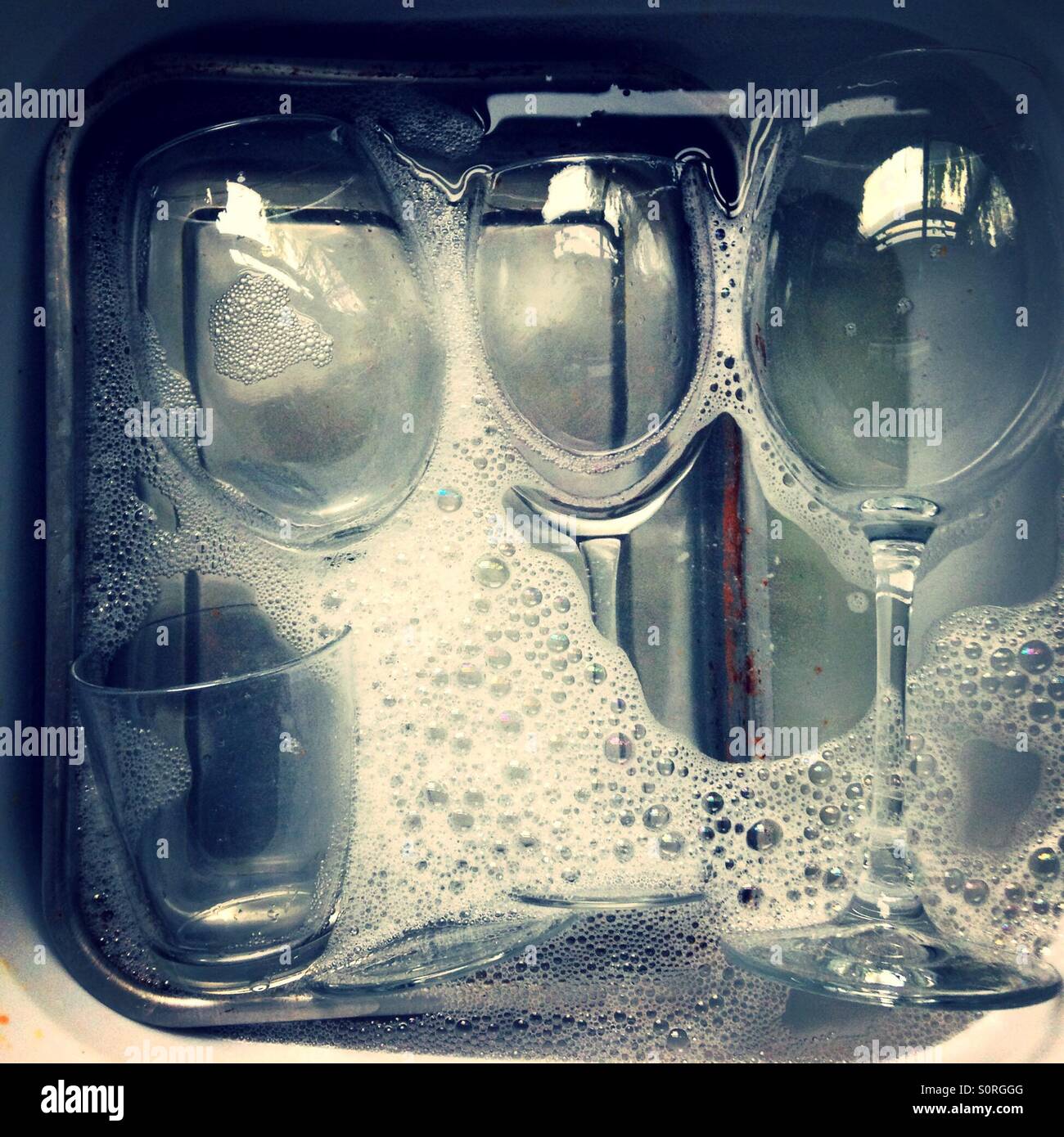 Wine glasses washing up Stock Photo - Alamy