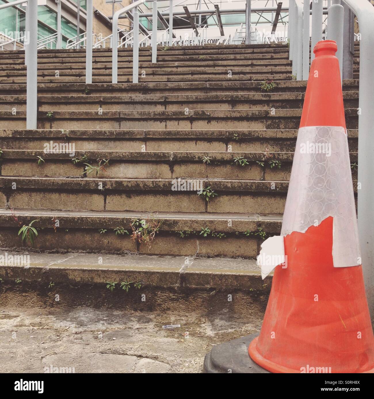 Steps leading to concert arena with traffic cone Stock Photo - Alamy