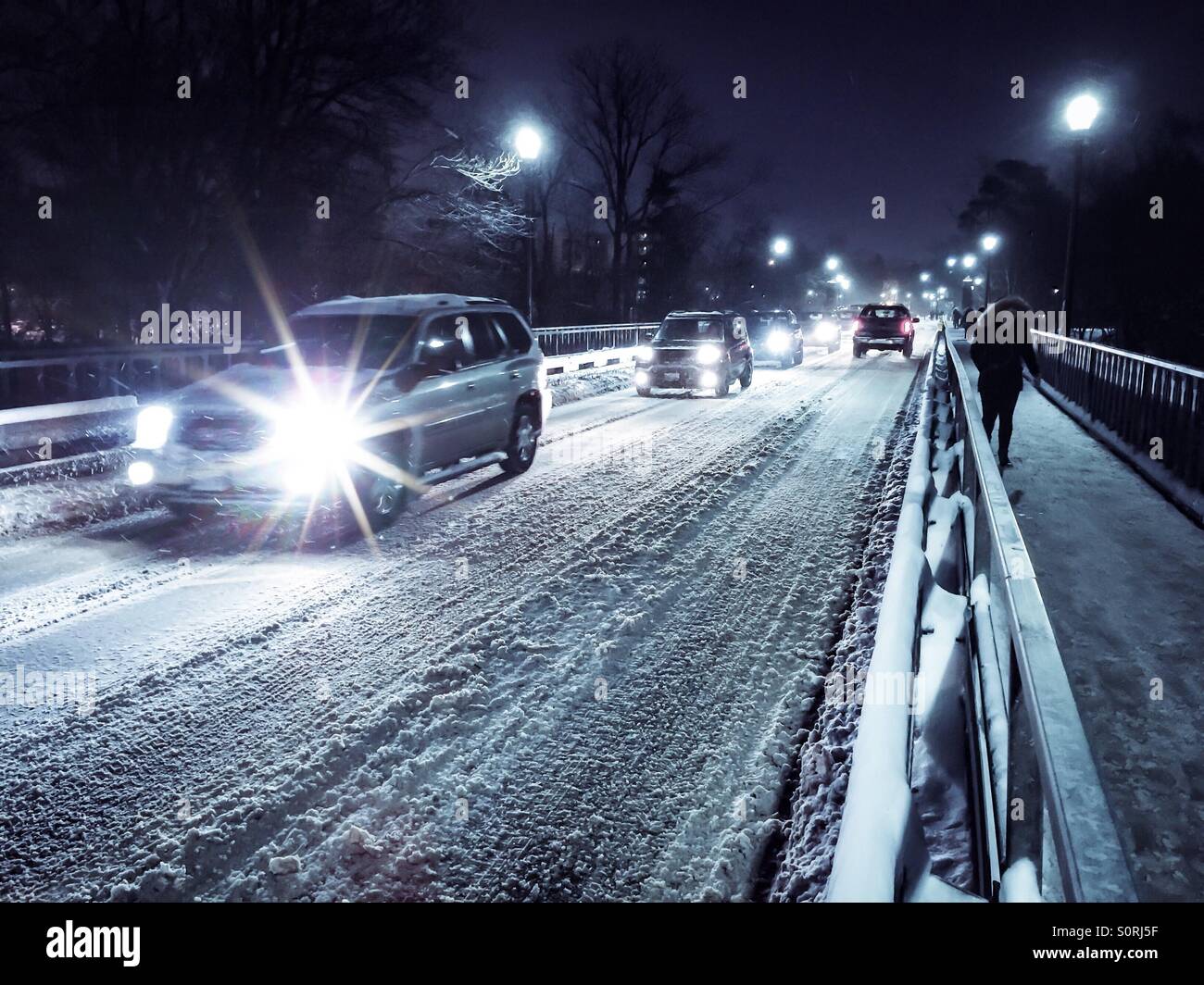 Bridge in winter storm Stock Photo - Alamy