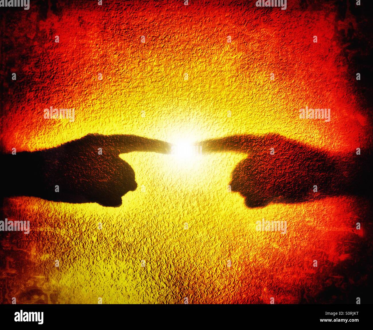 Spark between shadow of two pointing hands Stock Photo - Alamy