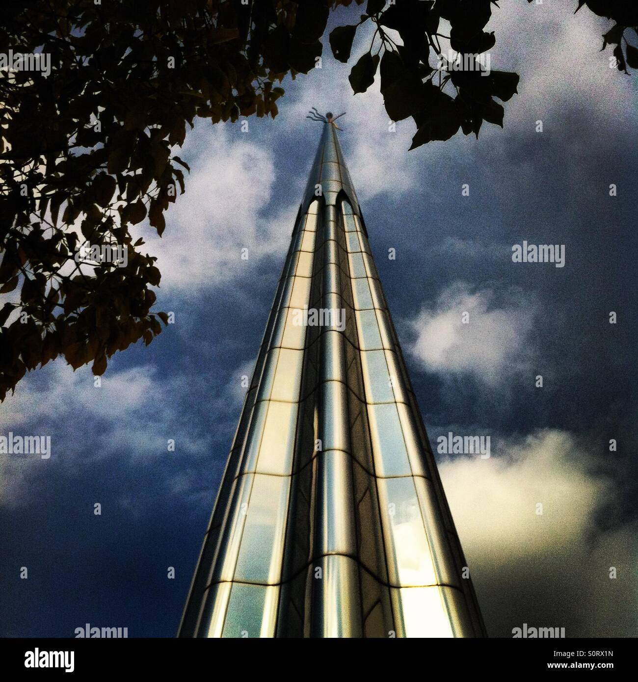 Metallic tower and tree Stock Photo - Alamy