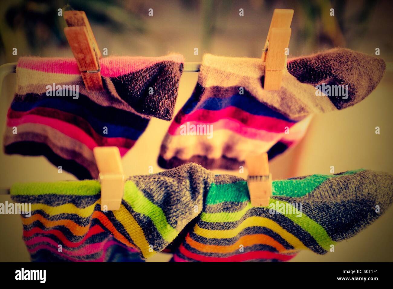 Pairs of socks on clothesline Stock Photo - Alamy