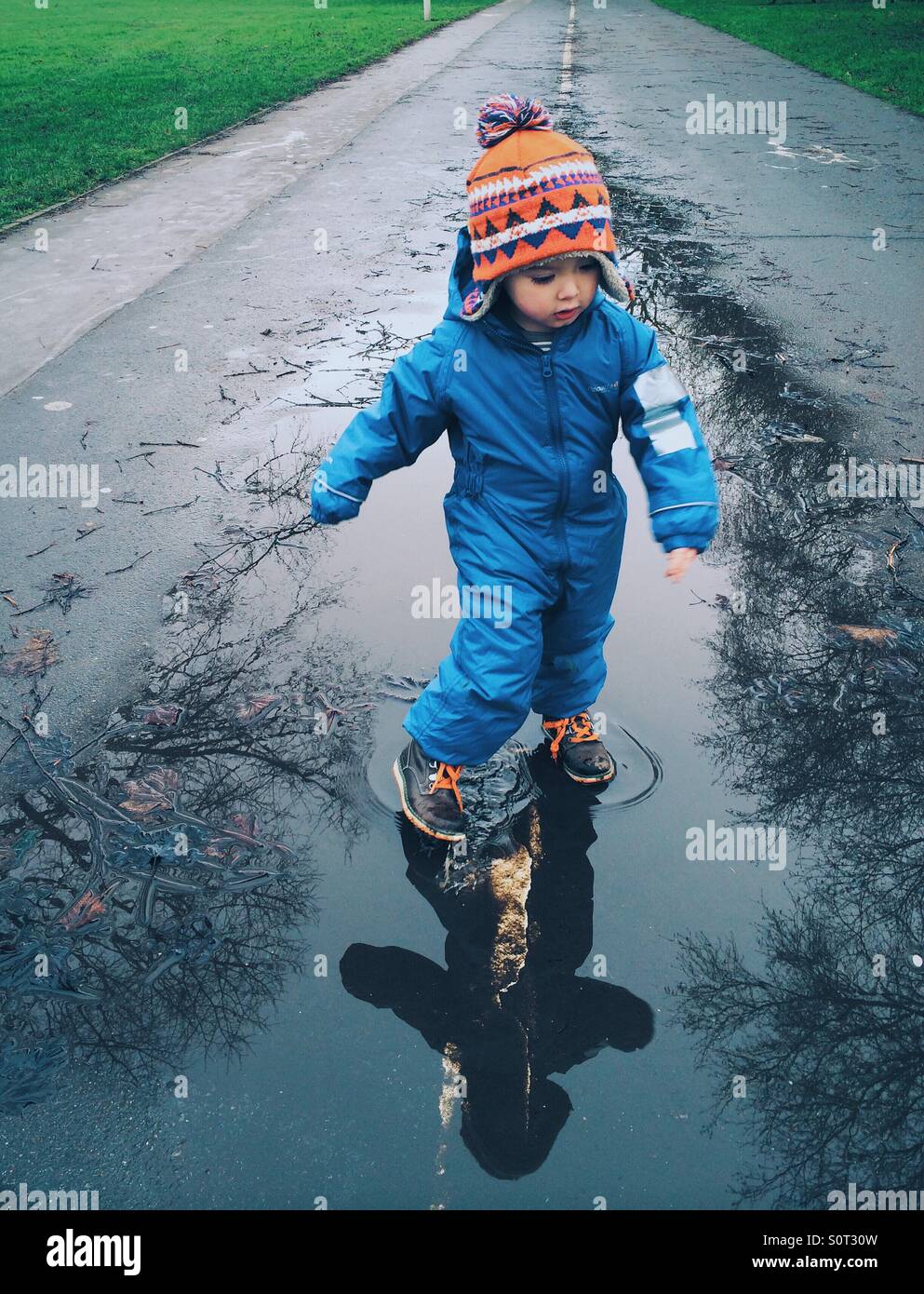 Child Dancing In Rain