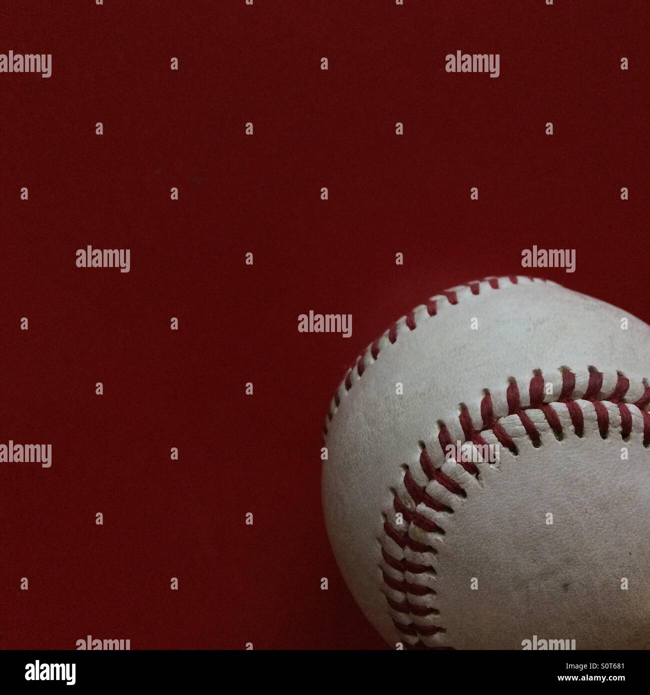 baseball on red background Stock Photo - Alamy
