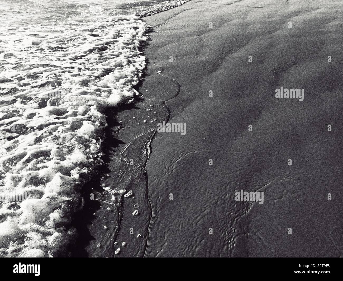 Small waves breaking Stock Photo - Alamy Small waves breaking Stock Photo - Alamy