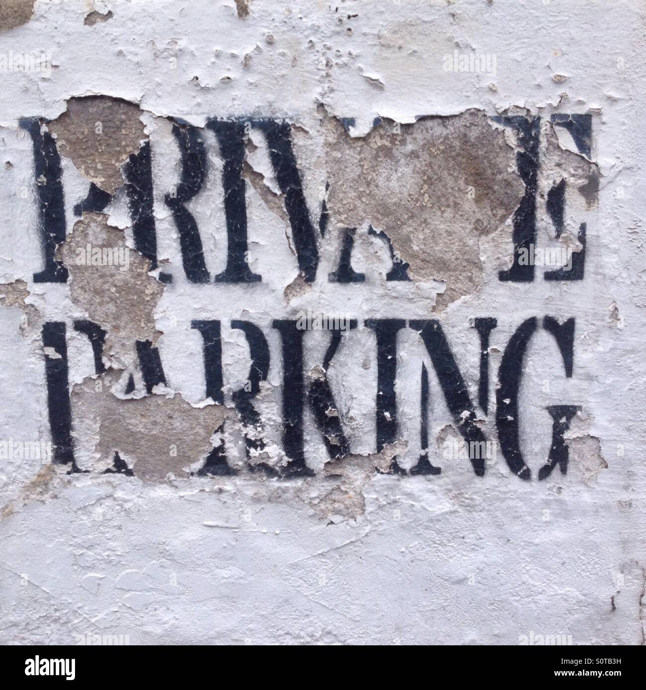 Peeled off parking sign Stock Photo - Alamy