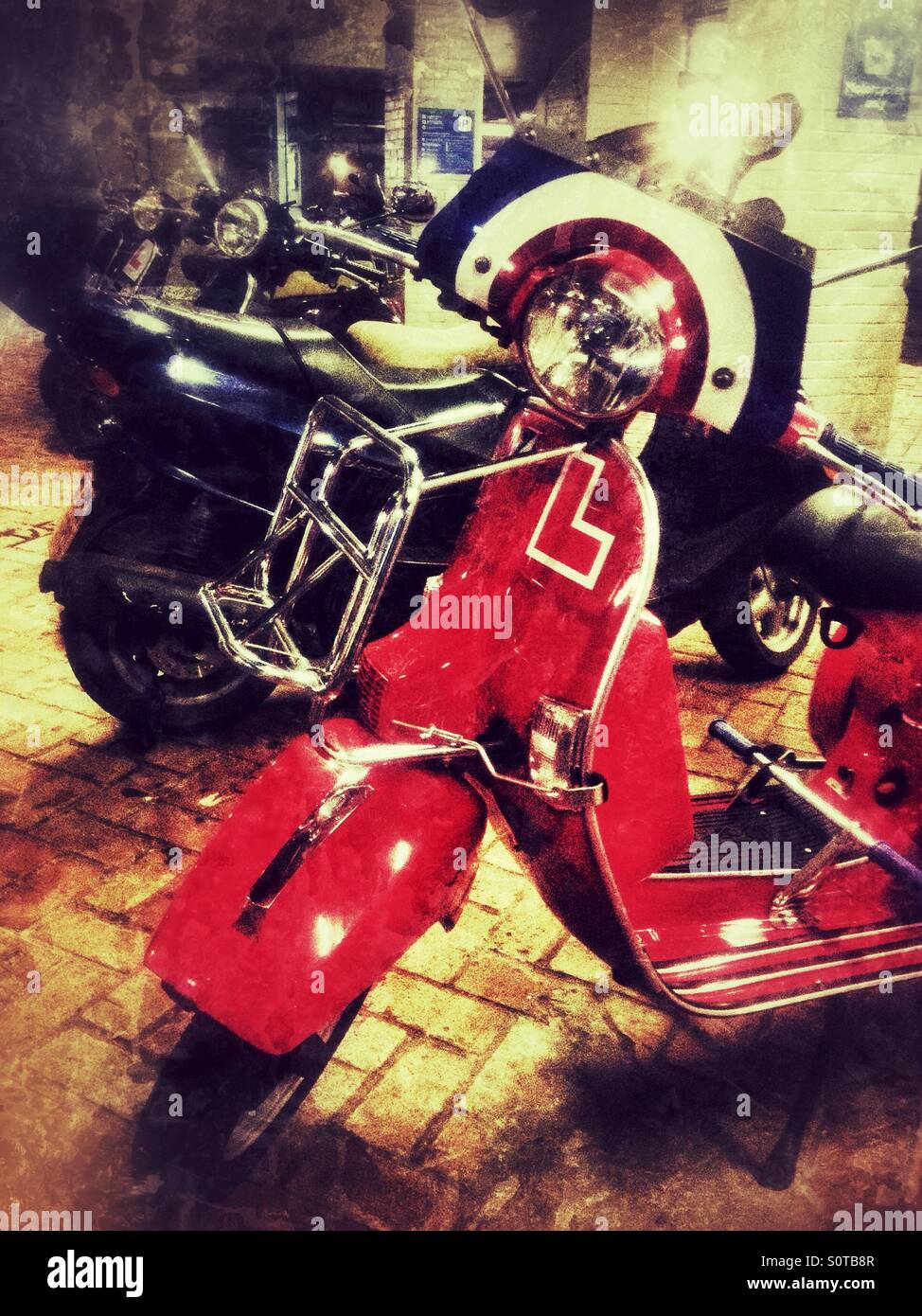 The front of a red moped scooter Stock Photo - Alamy