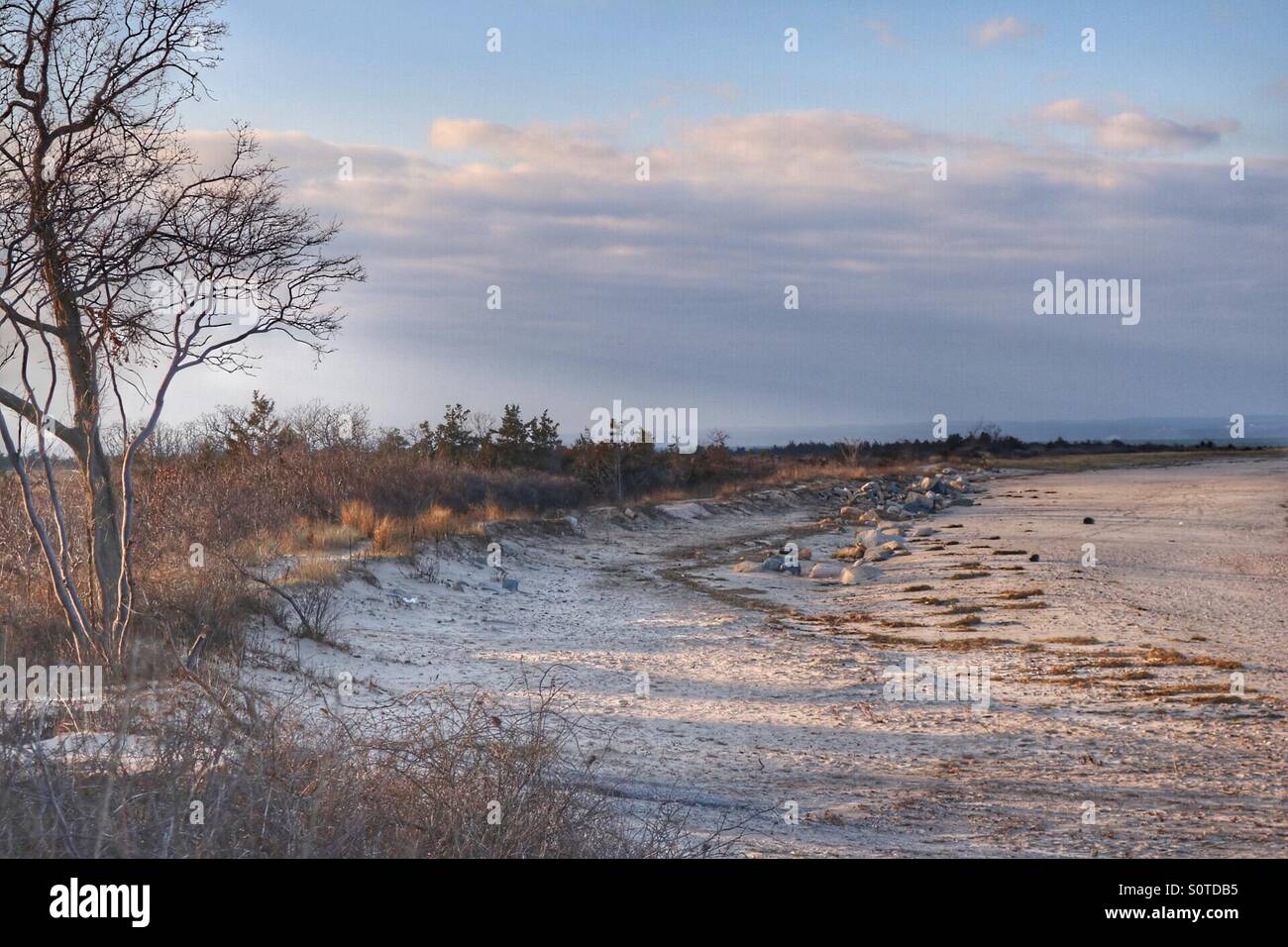Beach scene right before sunset Stock Photo - Alamy