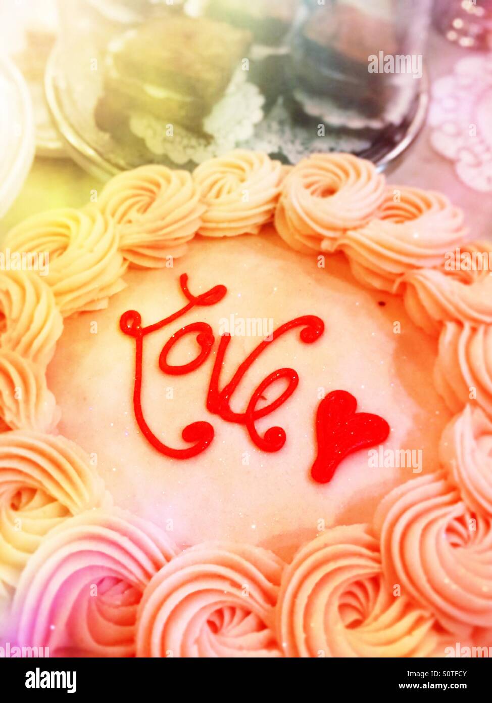 Gourmet layer cake with love and heart in icing on top Stock Photo - Alamy