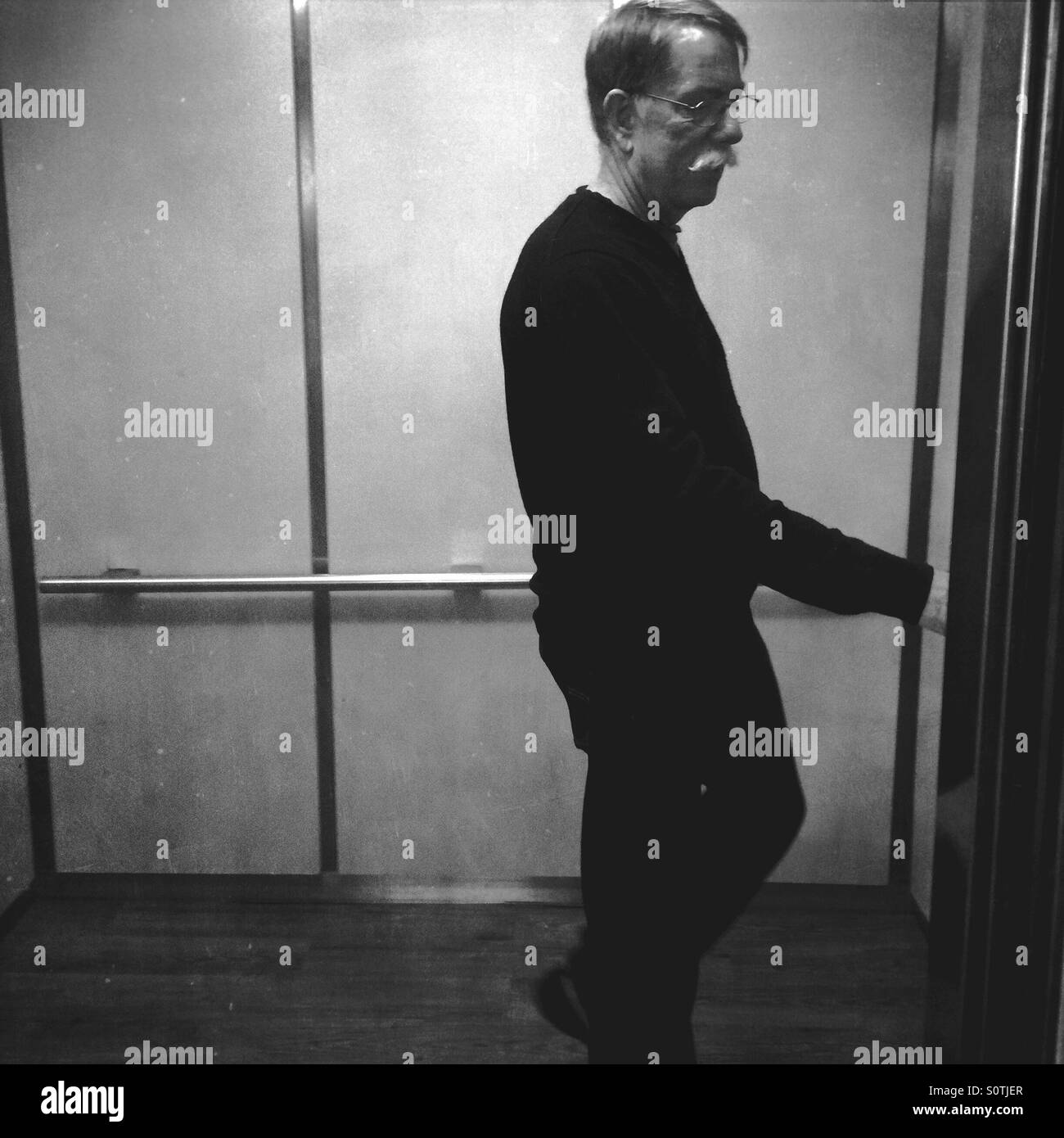 Man in an elevator hi-res stock photography and images - Alamy