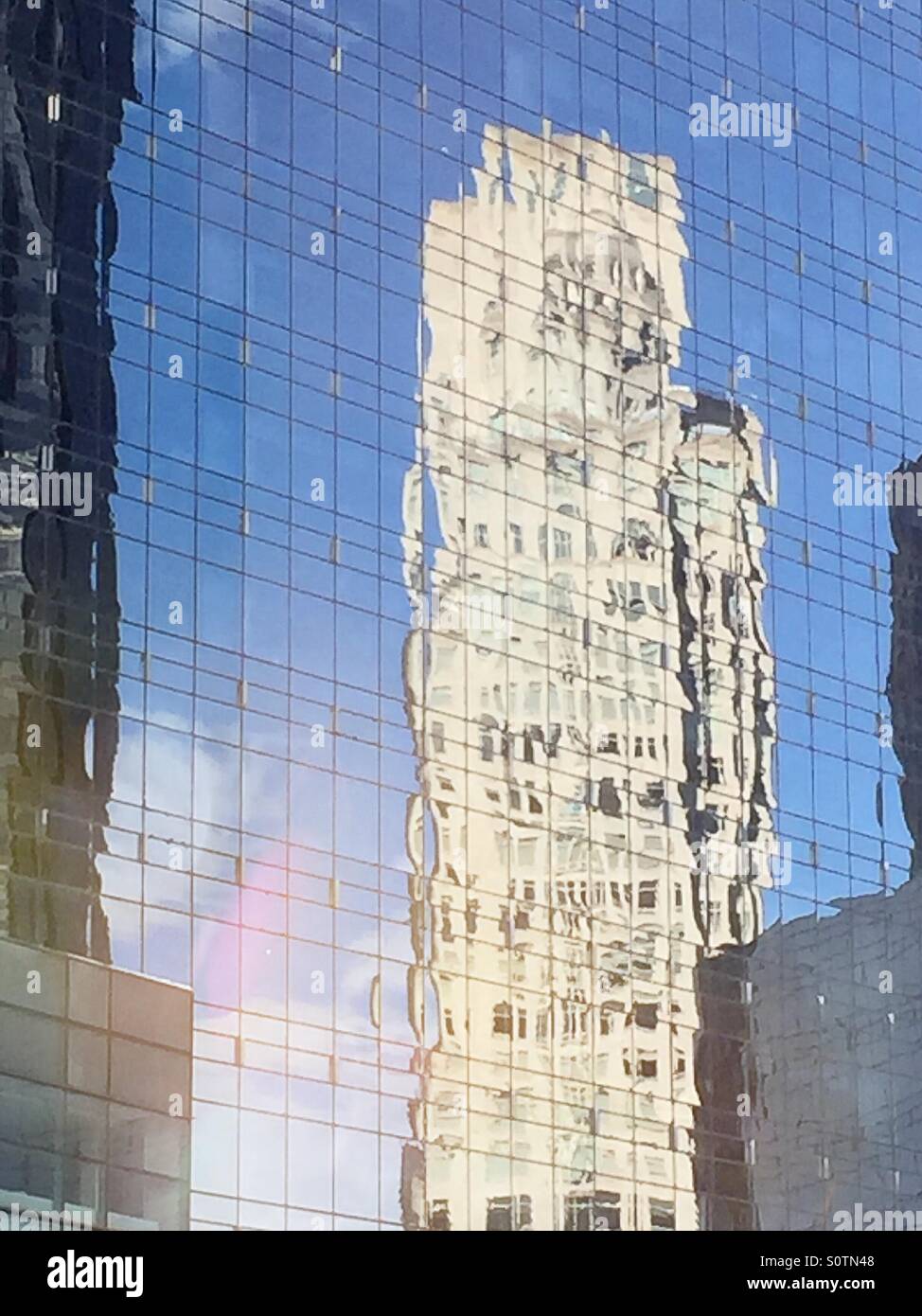 Skyscraper reflection on the glass the side of the Time Warner Center ...
