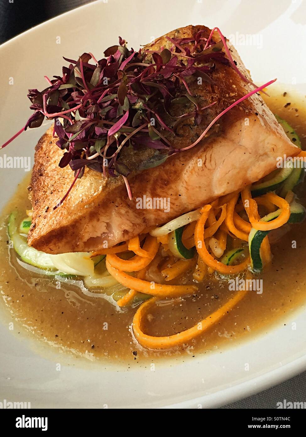 Scottish salmon main course meal with zucchini and butternut squash ...