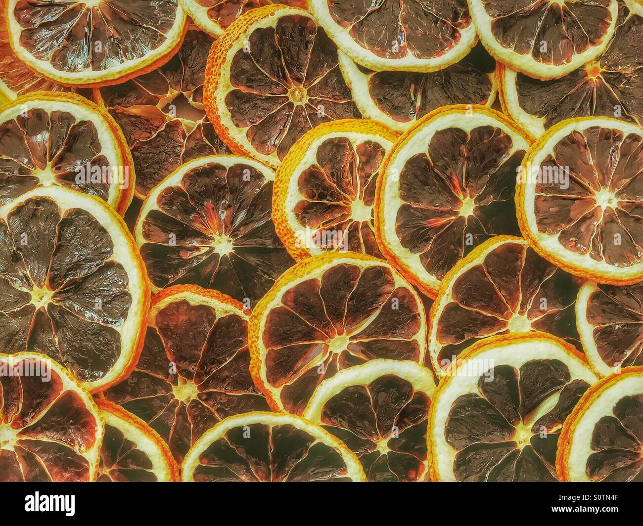 Dried citrus slices background Stock Photo - Alamy
