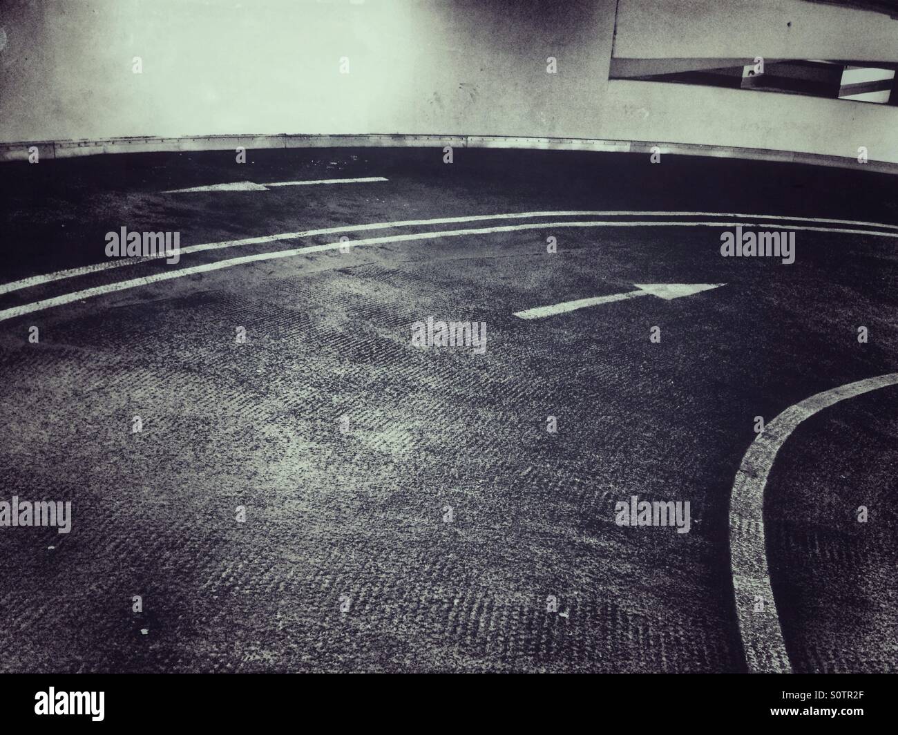 Driveway of a parking garage at night Stock Photo - Alamy