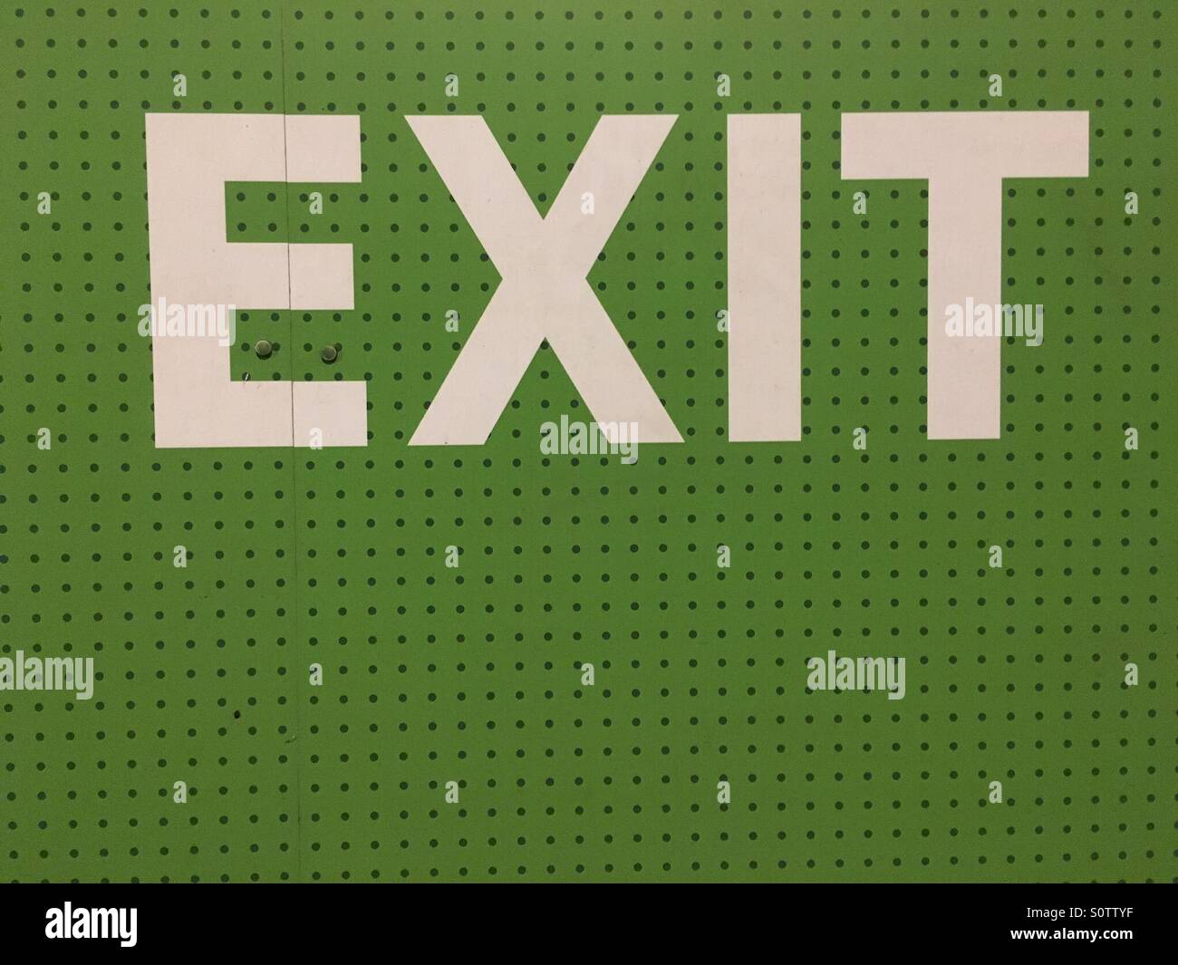 The word EXIT on a green dotted background Stock Photo - Alamy