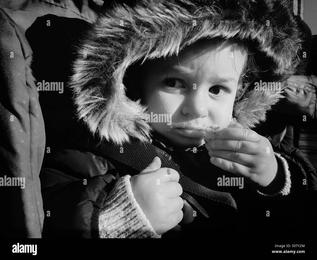 Toddler eating portrait Stock Photo - Alamy