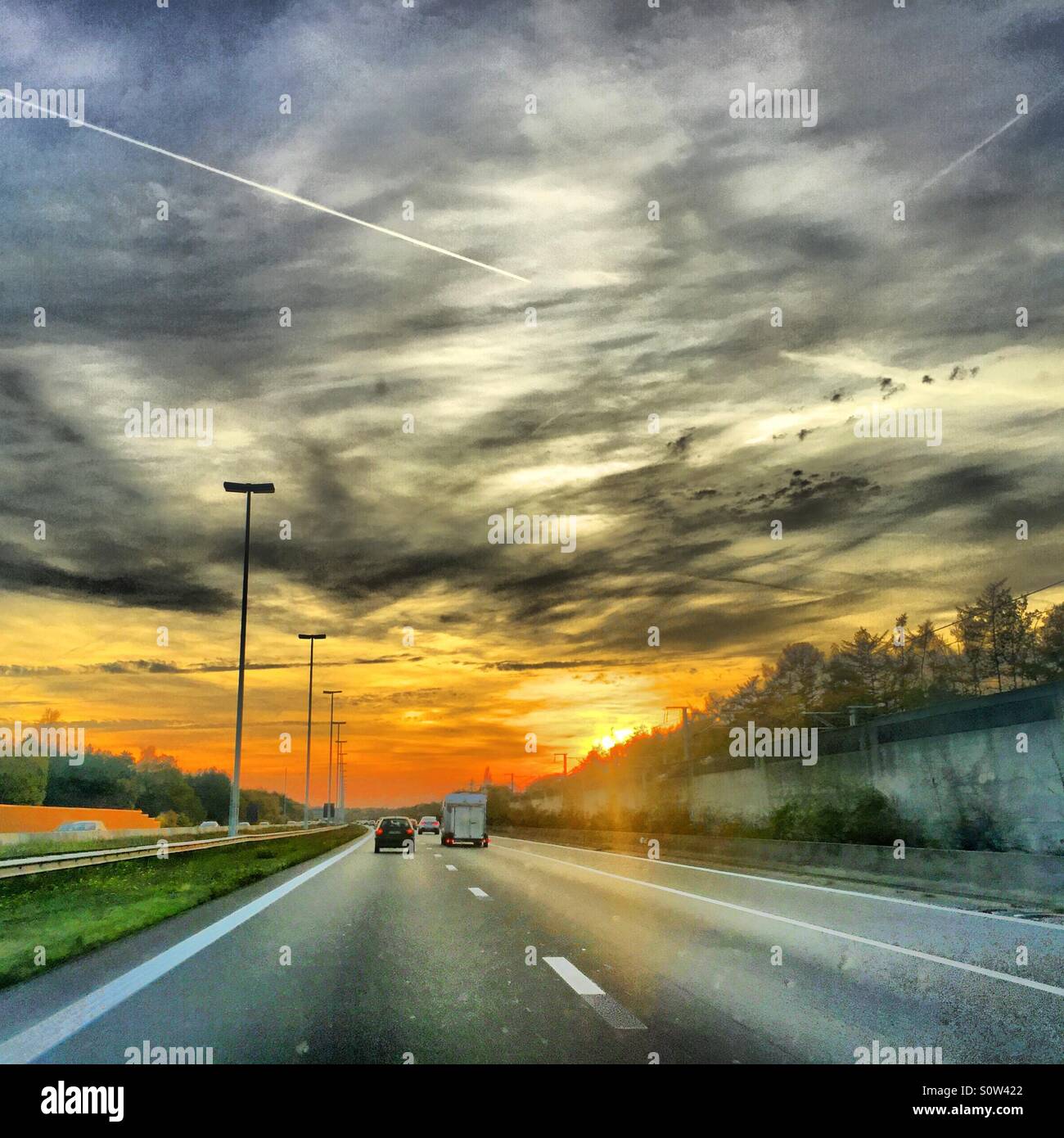 Sunset over the Highway Stock Photo - Alamy