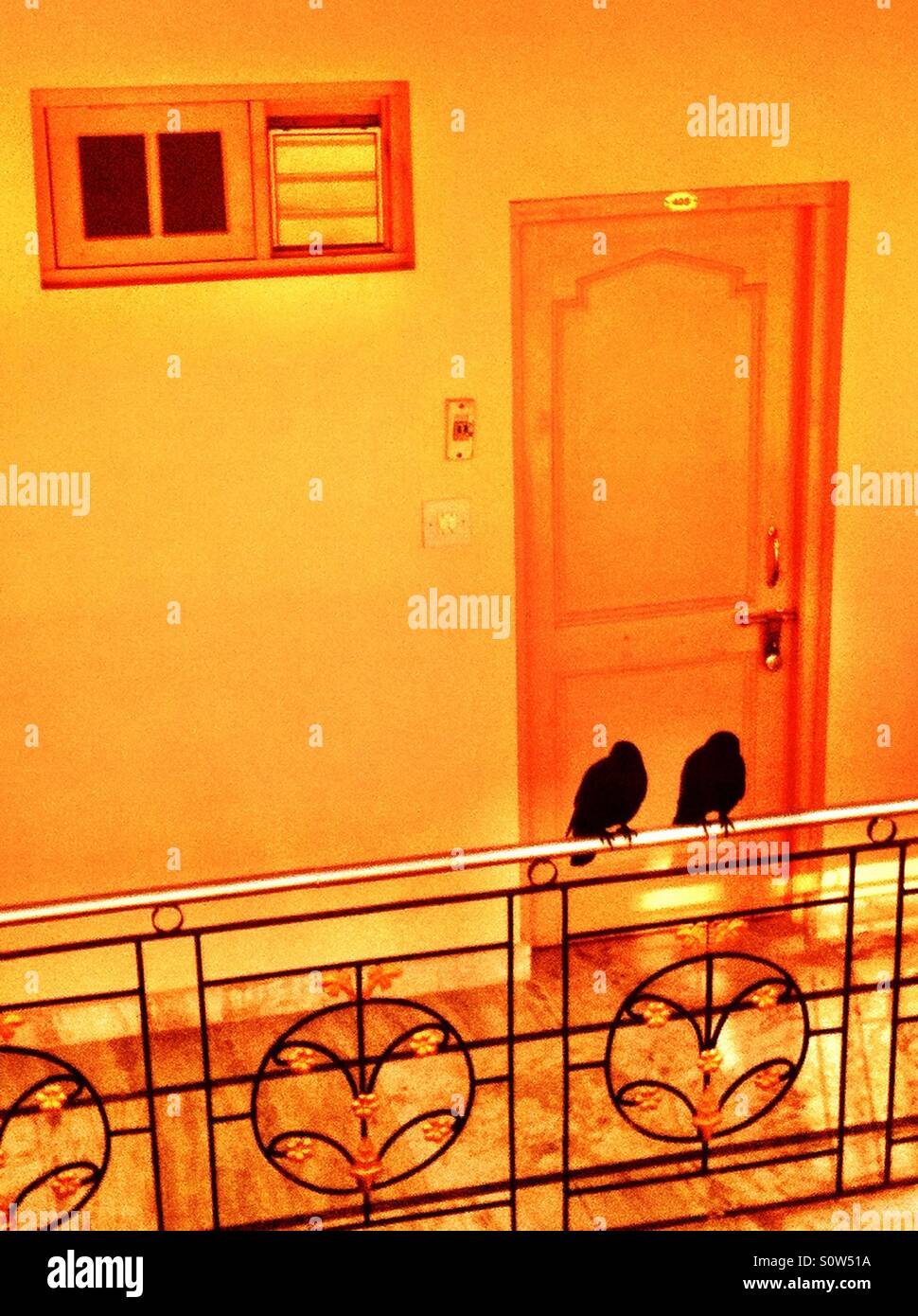 Couple sitting on balcony hi-res stock photography and images - Alamy