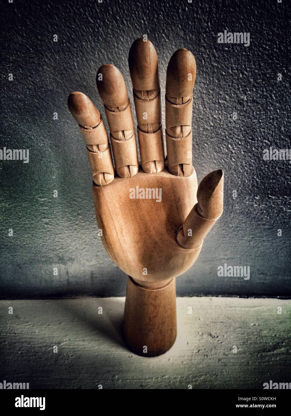 Wooden articulated hand palm forward Stock Photo - Alamy