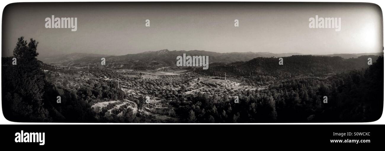 Hazy panorama as a dust cloud filters sunlight over Catalonia, Spain ...