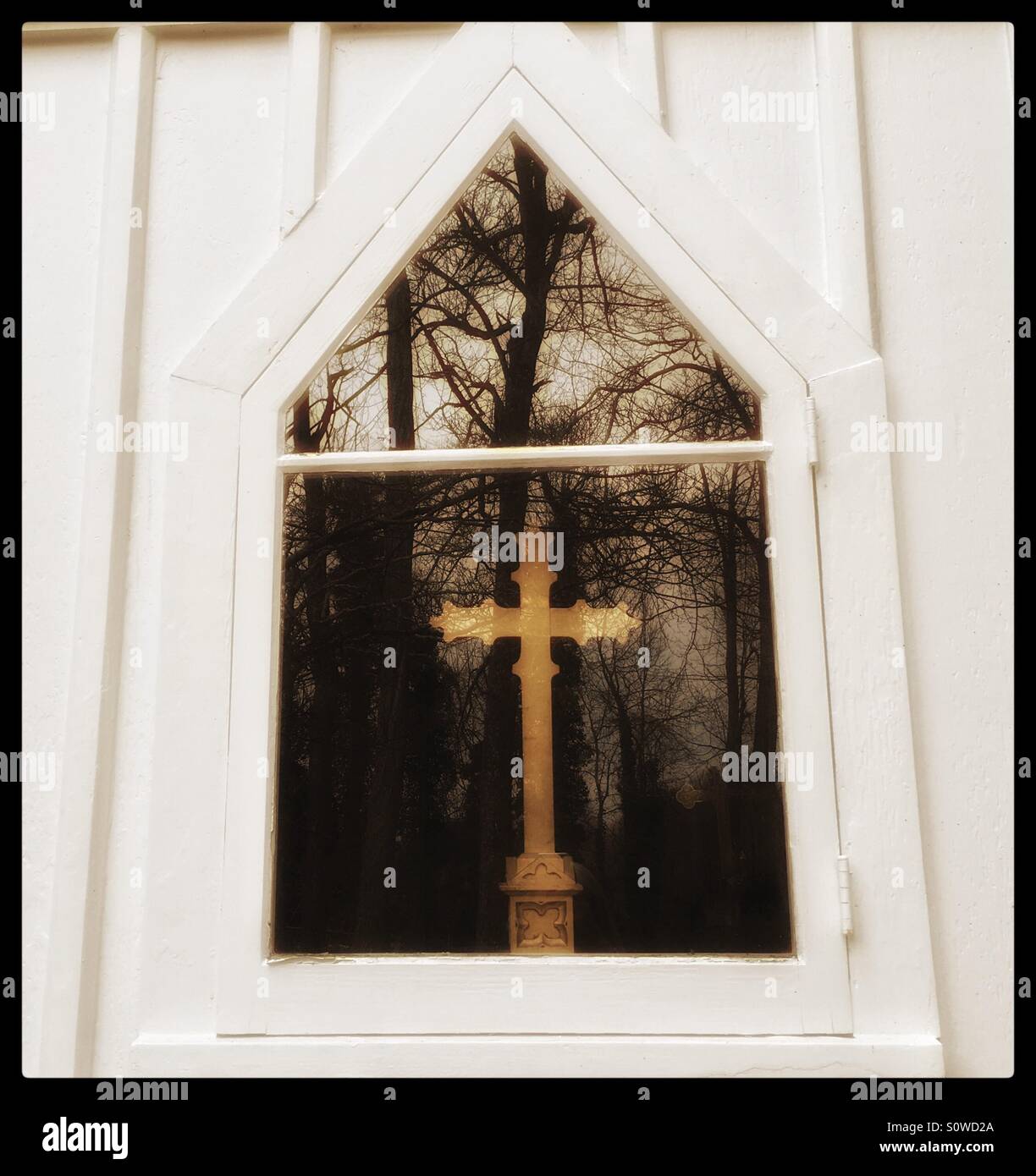 Cross in church window Stock Photo - Alamy