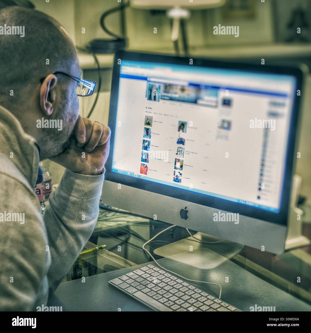Man looking the screen Stock Photo - Alamy
