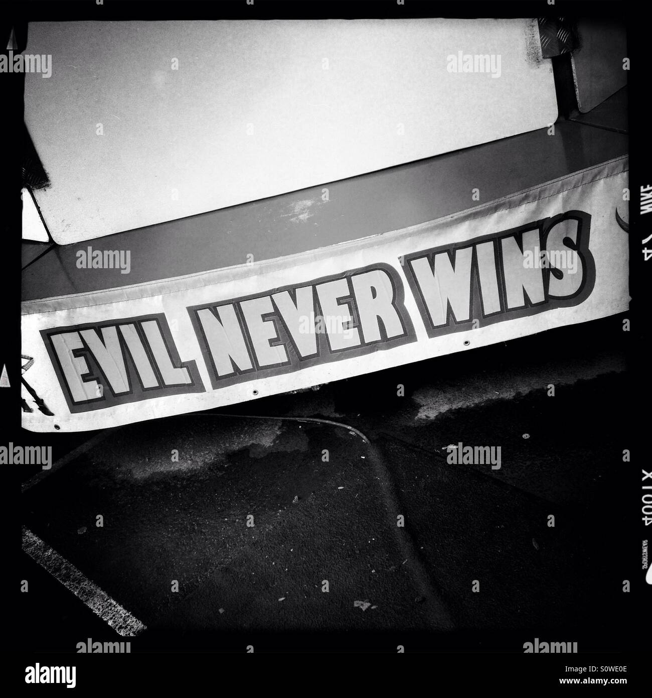 Evil Never Wins sign Stock Photo - Alamy