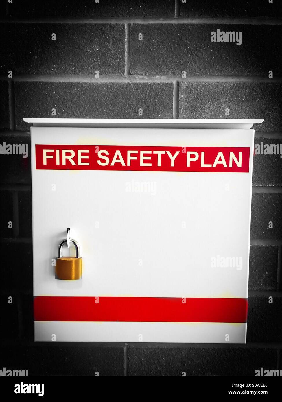 Fire safety box on grey wall Stock Photo - Alamy