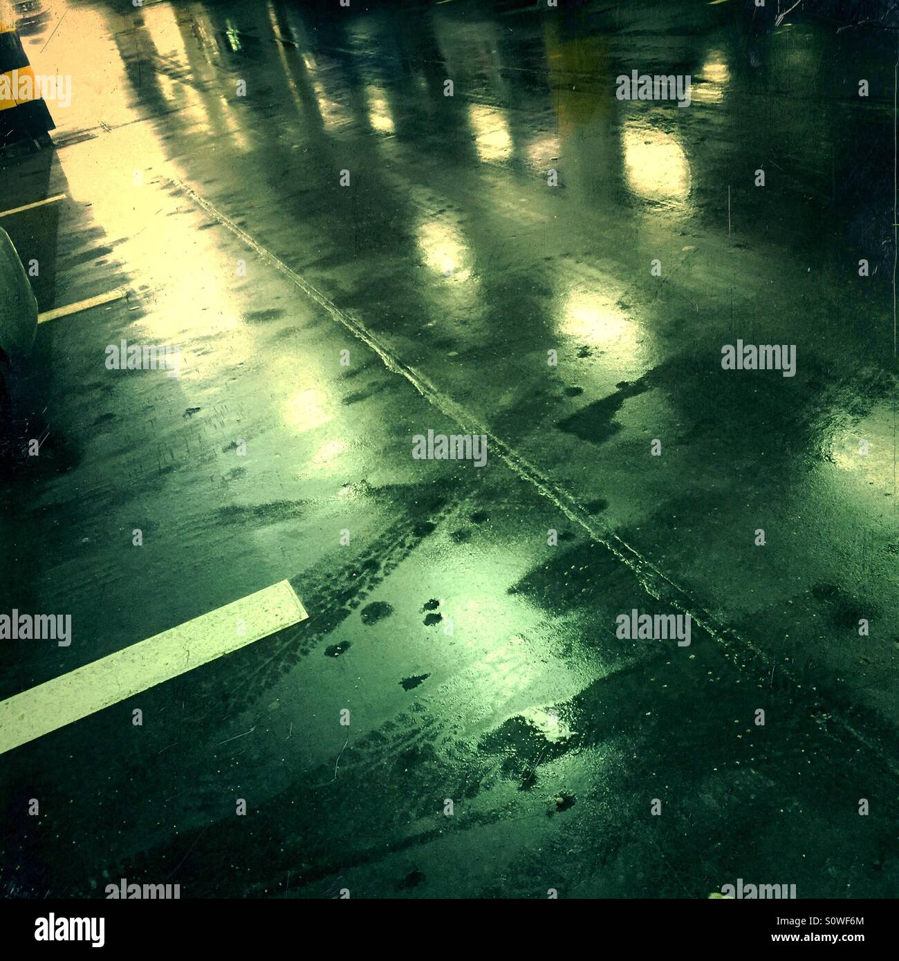 Wet parking lot Stock Photo - Alamy