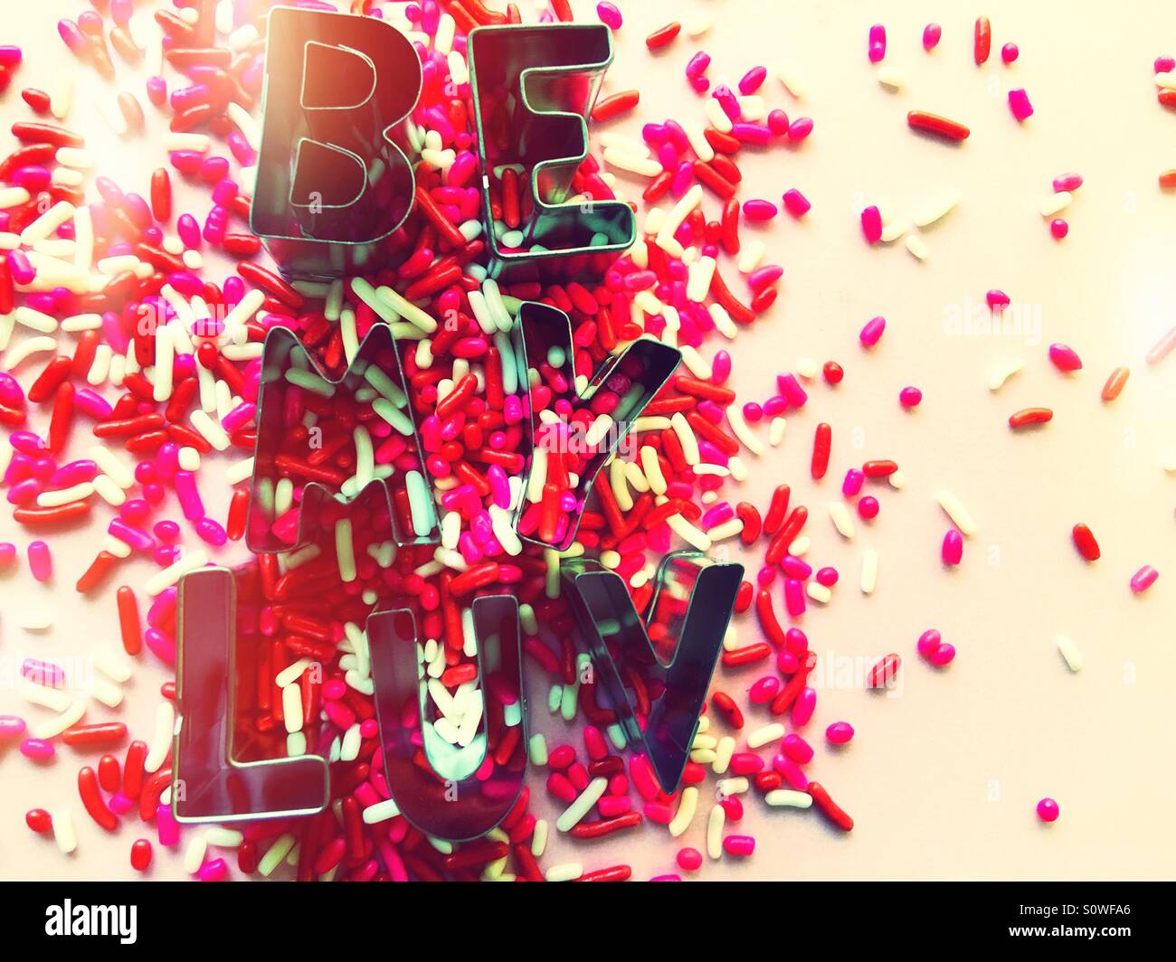 Be my luv words on candy sprinkles Stock Photo - Alamy