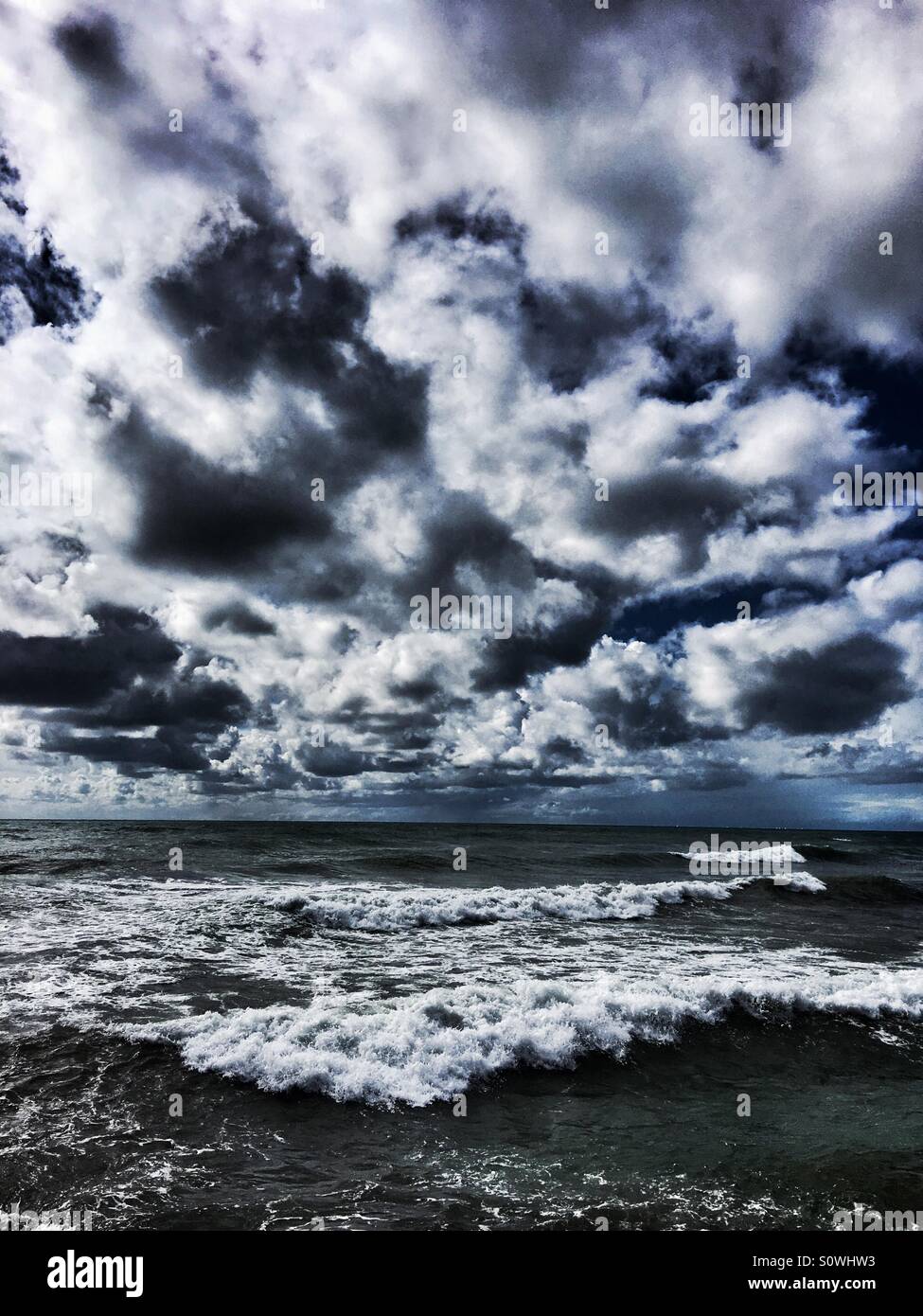 Sea and dramatic sky vertical Stock Photo - Alamy