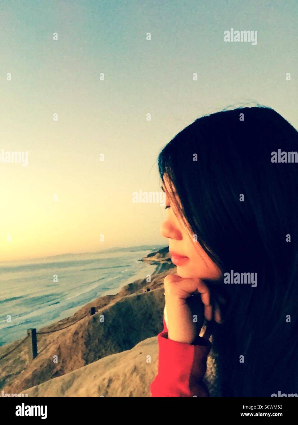 Listening to the ocean ,feeling the nature Stock Photo - Alamy