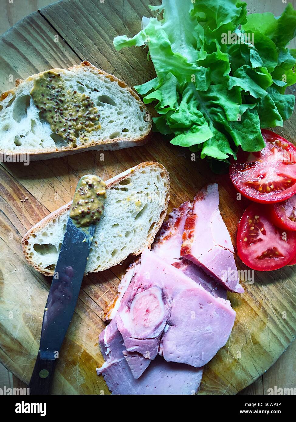 Preparing ham sandwich on rye Stock Photo - Alamy
