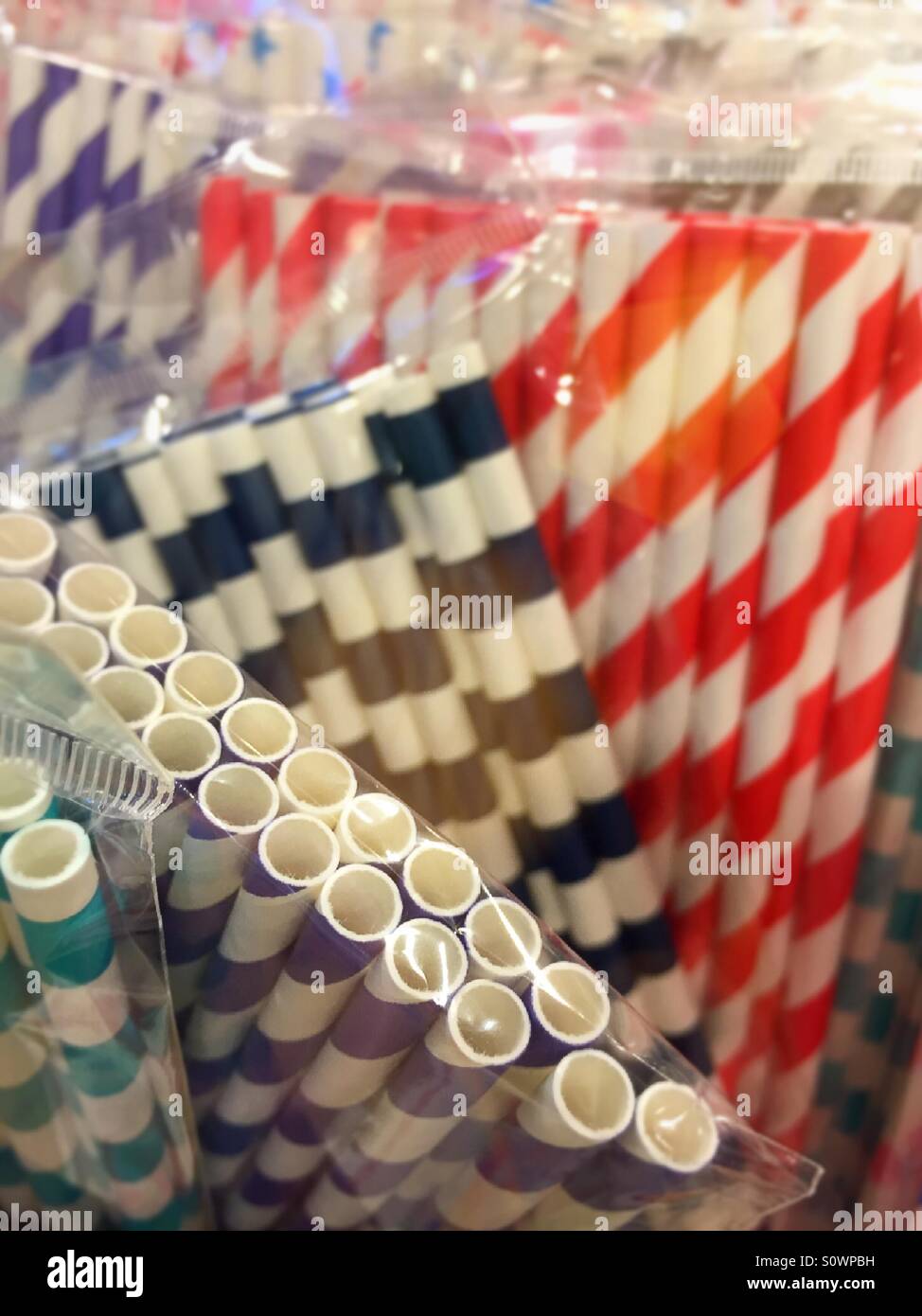 Colorful packets of paper straws Stock Photo - Alamy