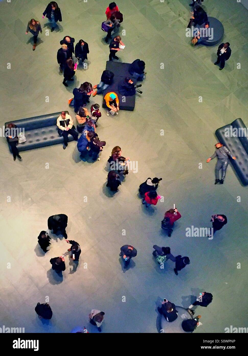 Patrons in the atrium of MOMA with interactive art exhibit Stock Photo ...
