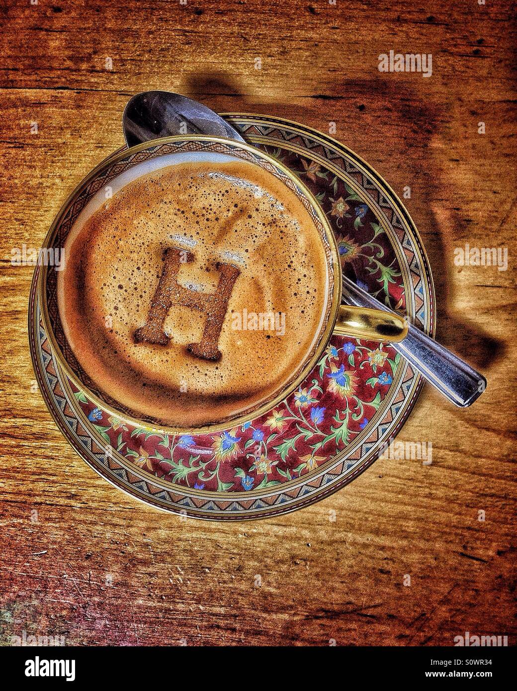 A coffee in a posh cup and saucer Stock Photo - Alamy