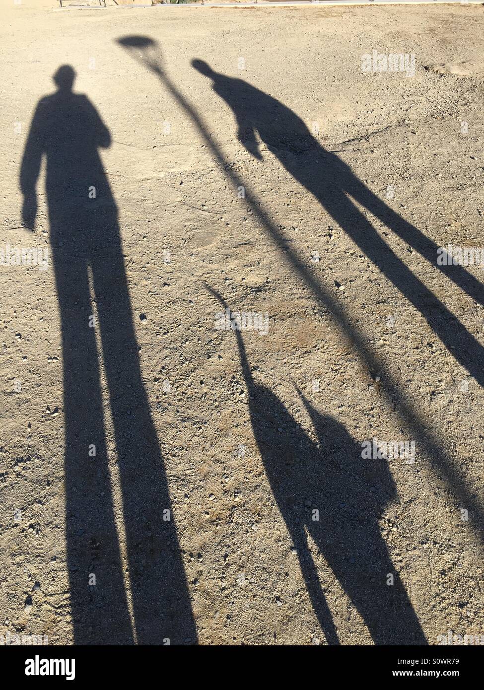 Shadows two people walking hi-res stock photography and images - Alamy