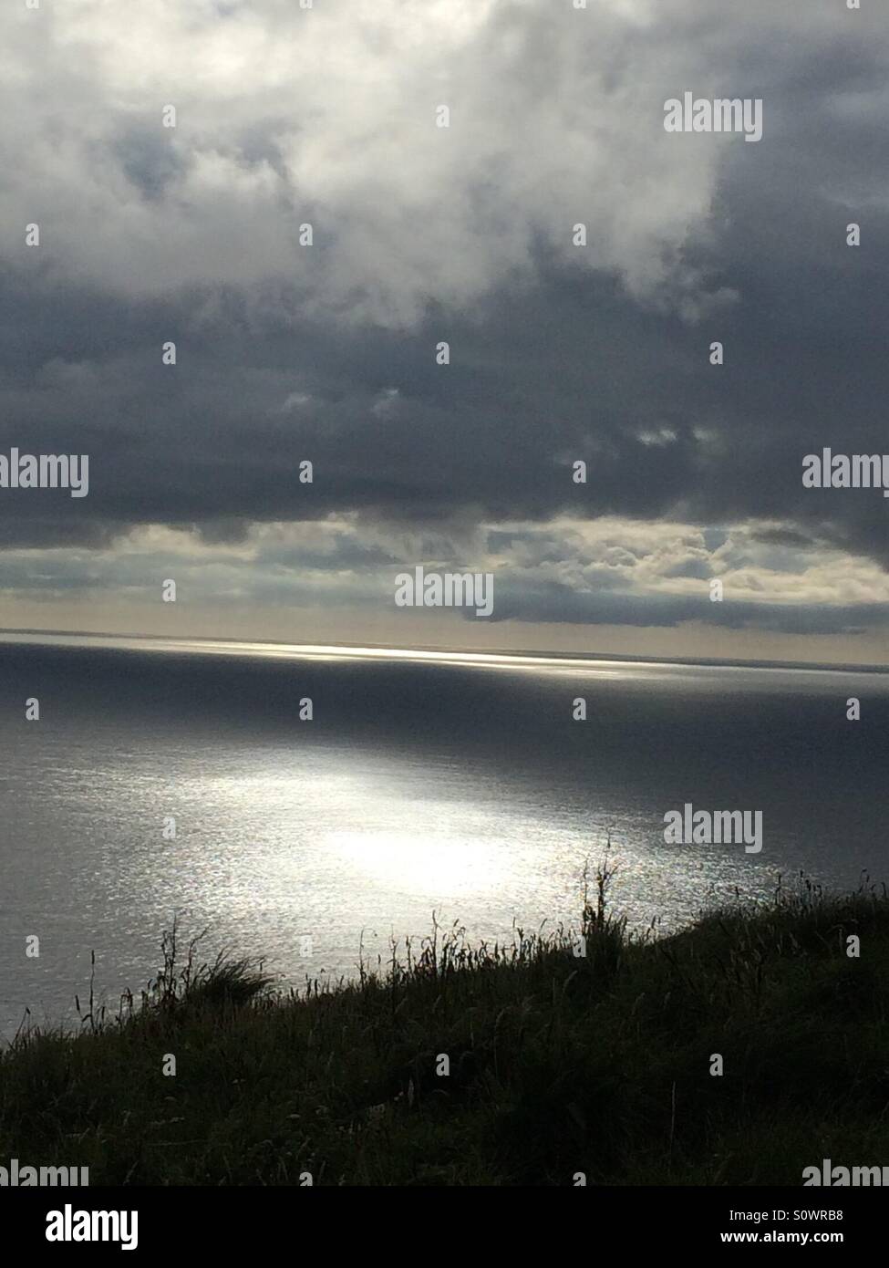 Ocean with a cloudy sky hi-res stock photography and images - Alamy