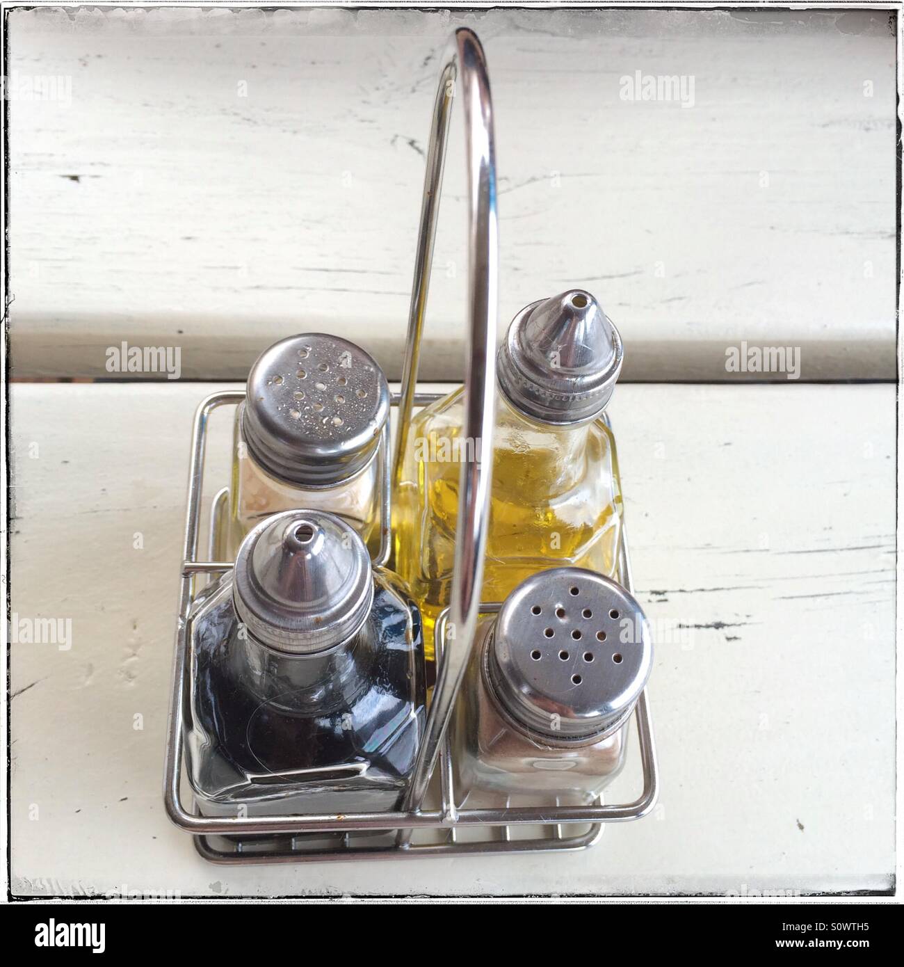 Condiments on restaurant table Stock Photo - Alamy