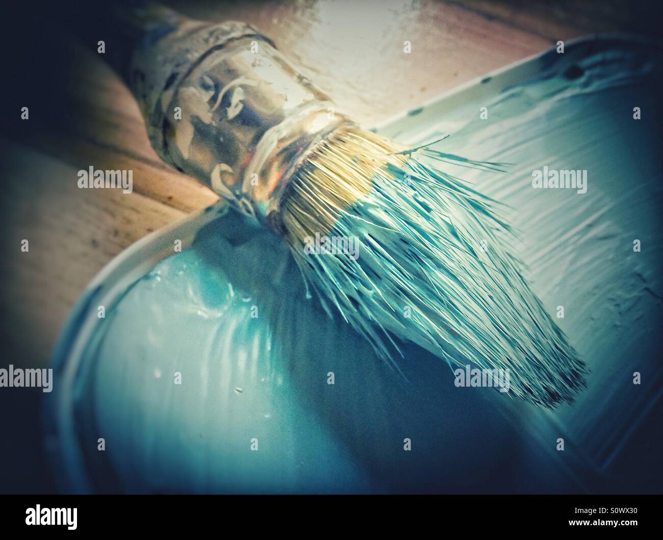 Paint brush of blue paint Stock Photo - Alamy