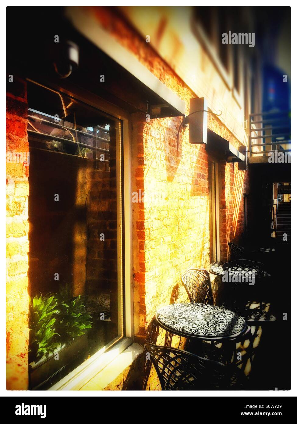 Basement coffee shop patio Stock Photo - Alamy