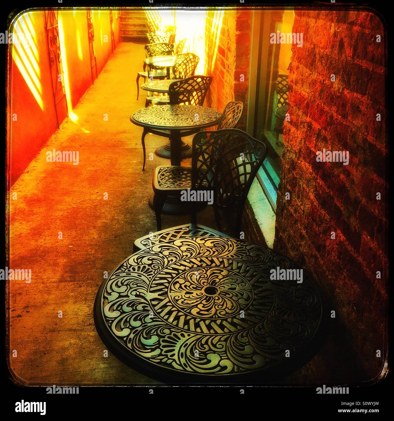Row of tables on basement ground in down town Stock Photo - Alamy